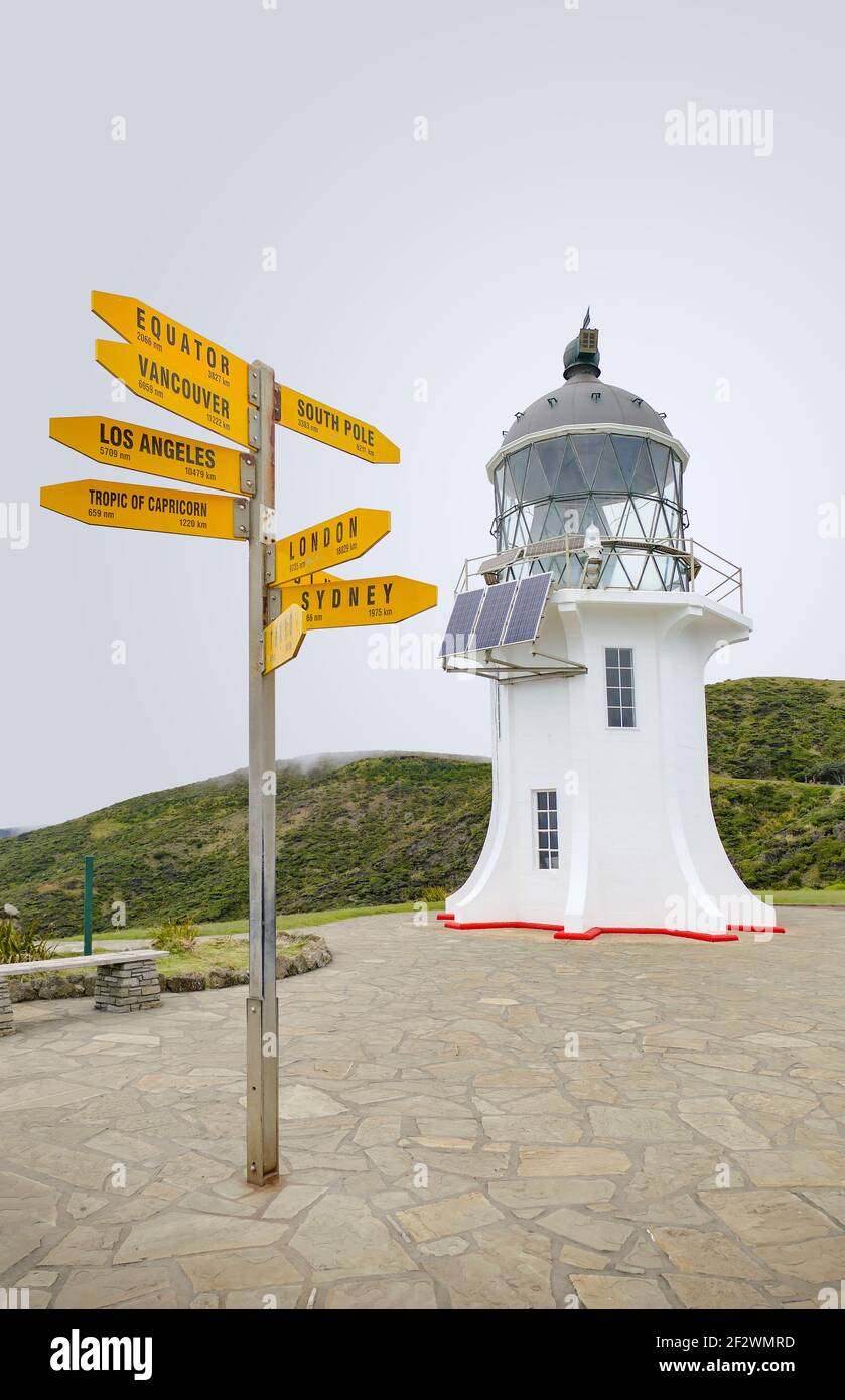 The Cape Reinga Lighthouse with signpost at the North Island in New ...