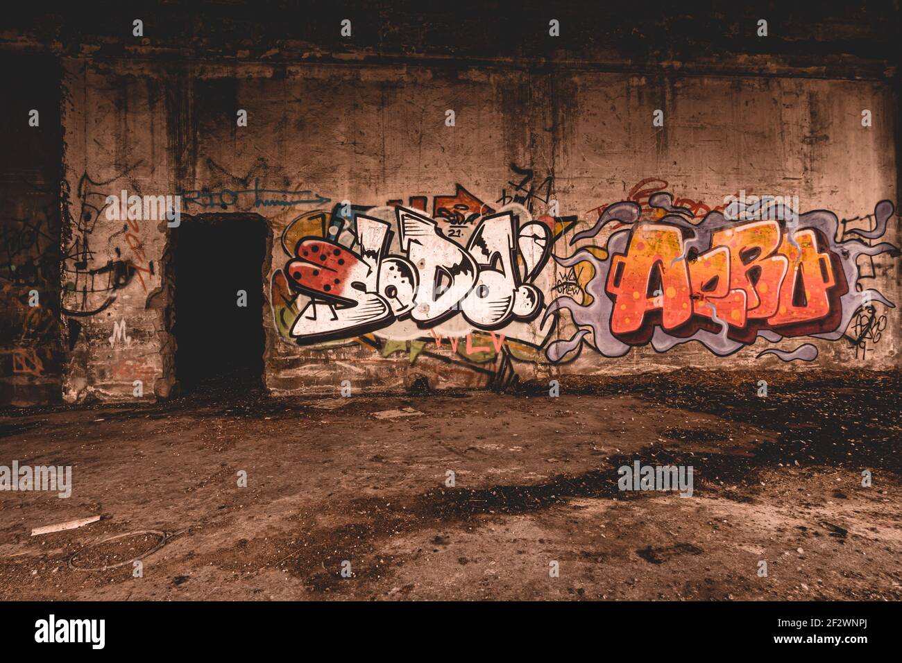 An old abandoned industrial area, with lots of graffiti that is slowly ...