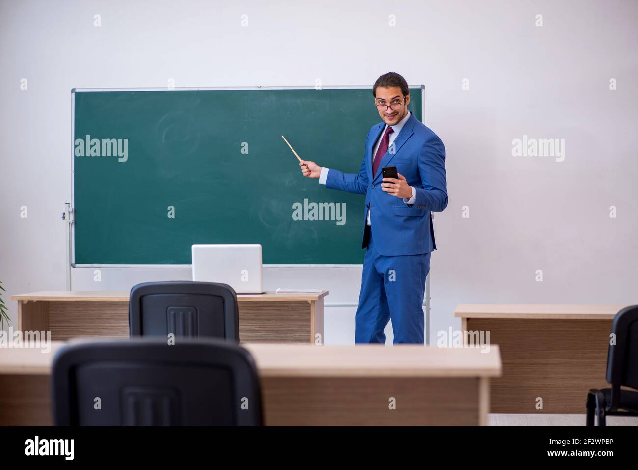 Teacher showing video in classroom hi-res stock photography and images ...