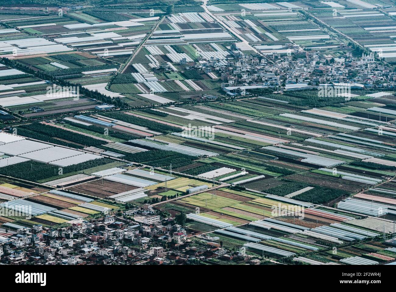 aerial view of agricultural plots of land under cultivation in an ...