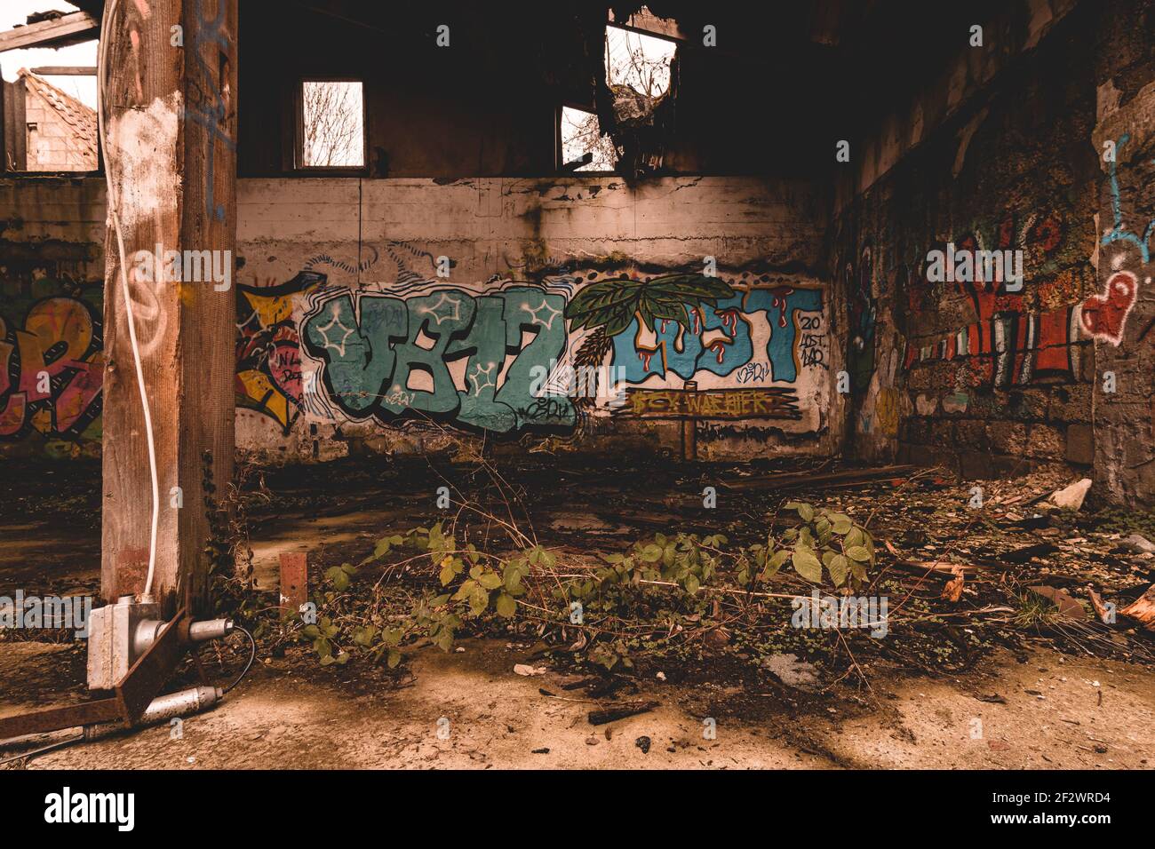 An old abandoned industrial area, with lots of graffiti that is slowly ...