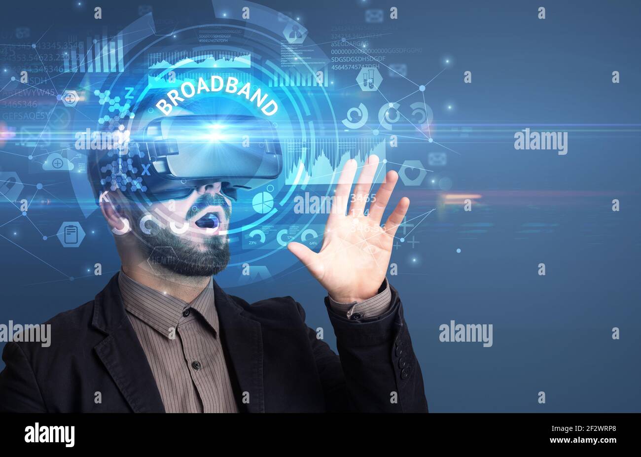 Businessman looking through VR glasses Stock Photo - Alamy