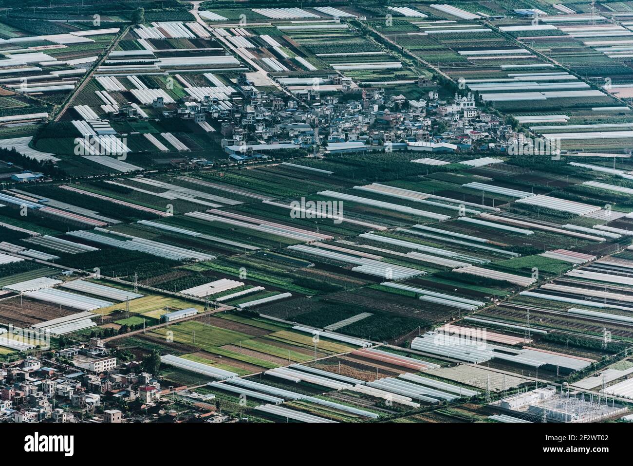 aerial view of agricultural plots of land under cultivation in an ...