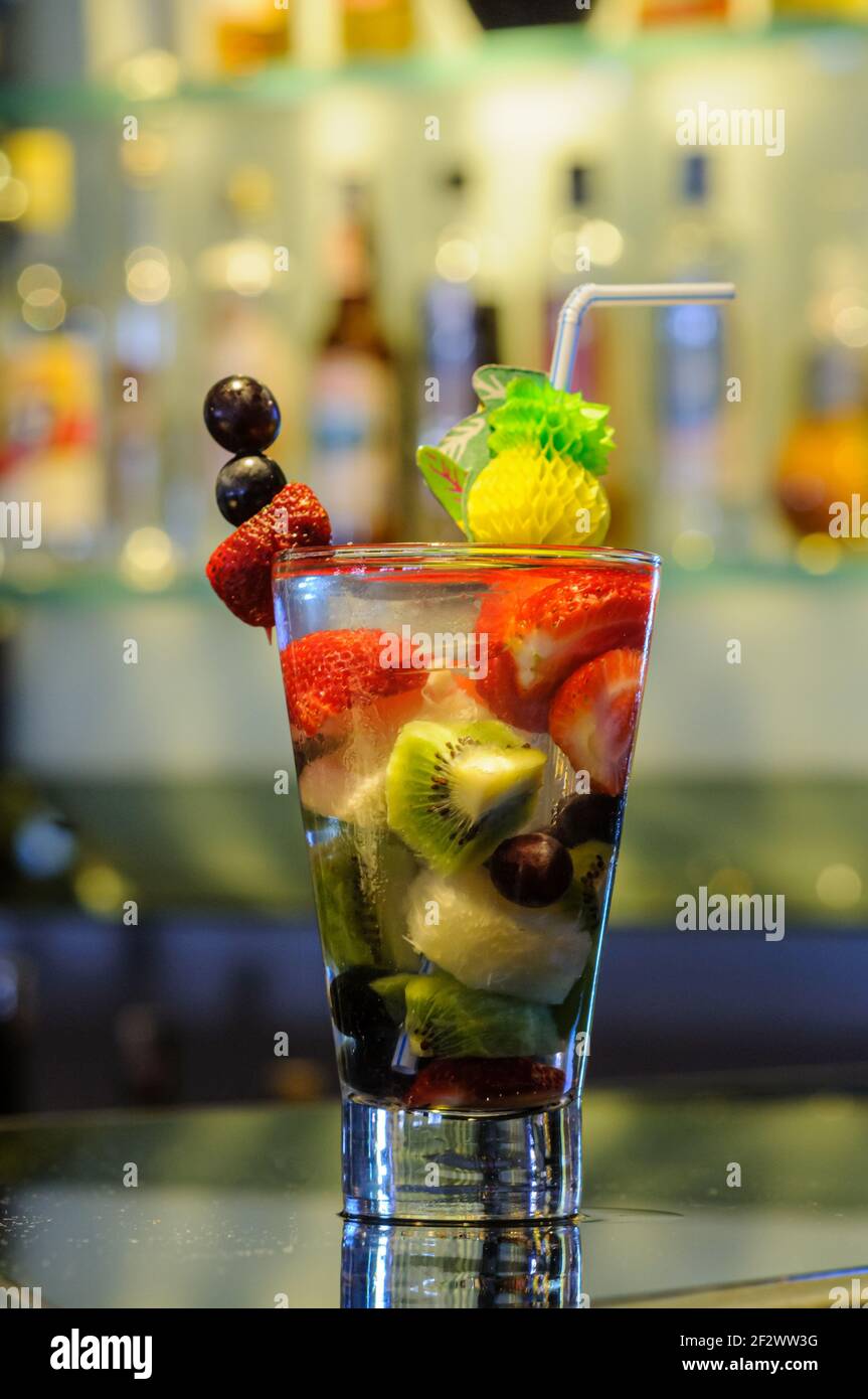 Fruit cocktail on a glass bar counter at night Stock Photo - Alamy