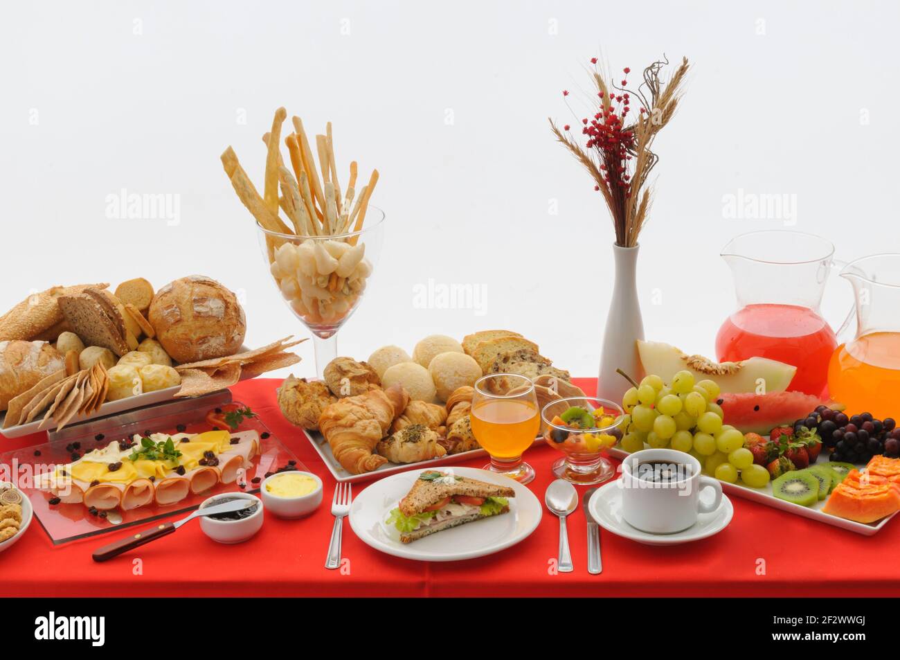 Gastronomy. Breakfast table with cup of coffee, sandwich, fruits, juice ...