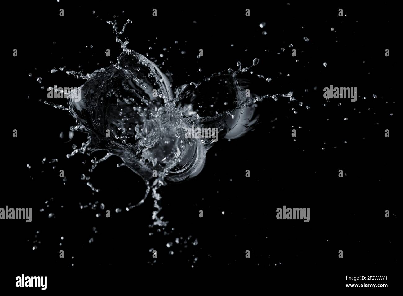 Clear water liquid splash with drops, isolated on a black background ...