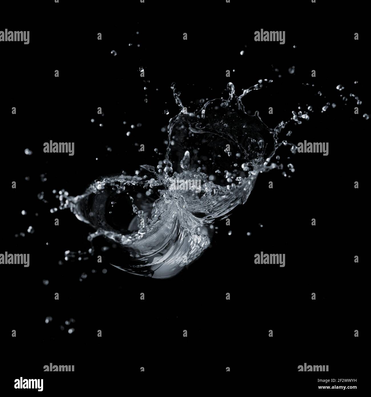 Clear water liquid splash with drops, isolated on a black background ...