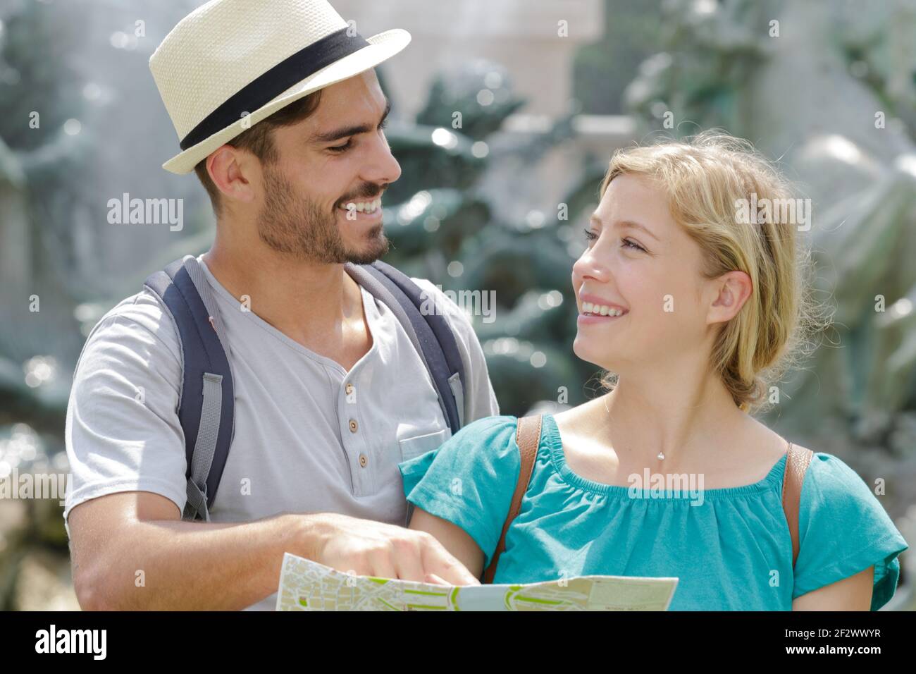 Cheerful tourists navigating city map hi-res stock photography and ...