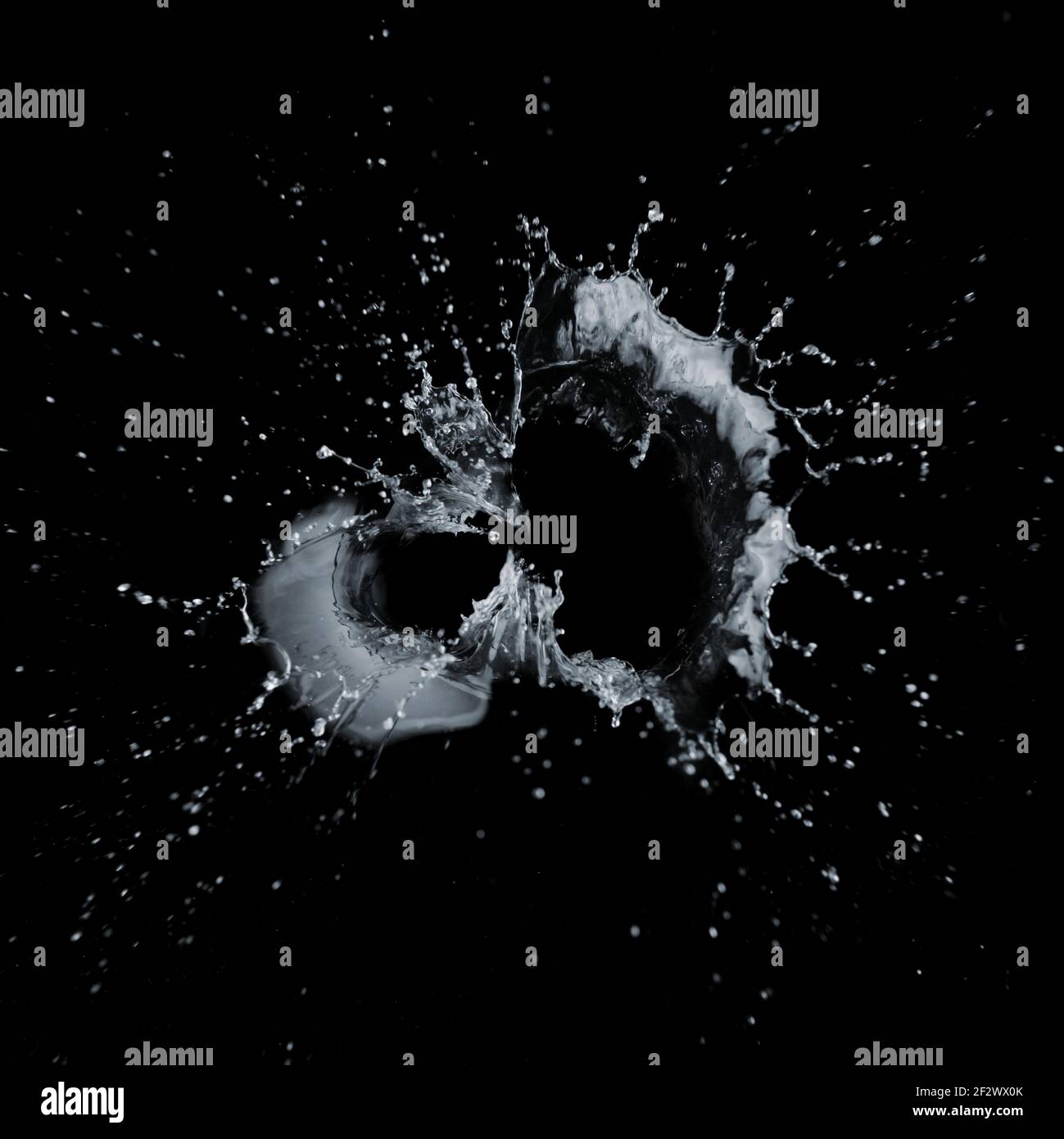 Clear water liquid splash with drops, isolated on a black background ...