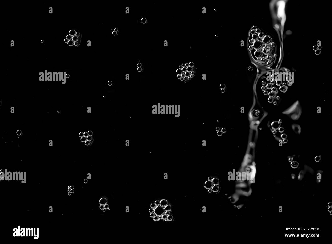Clear water liquid bubbles background. Isolated on a black Stock Photo ...