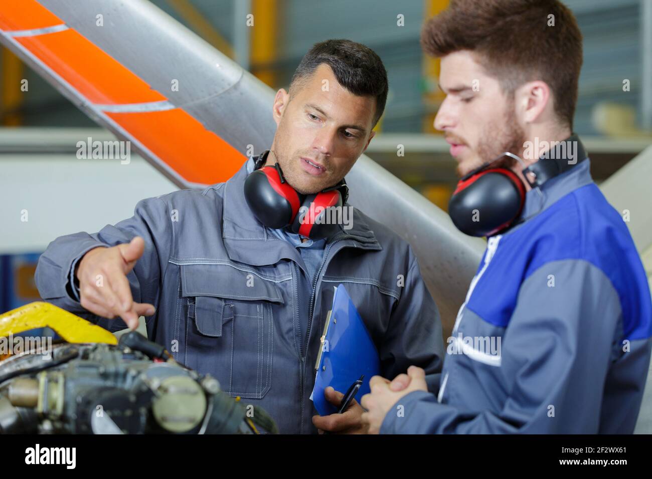 mechanical engineering apprentice with teacher Stock Photo - Alamy