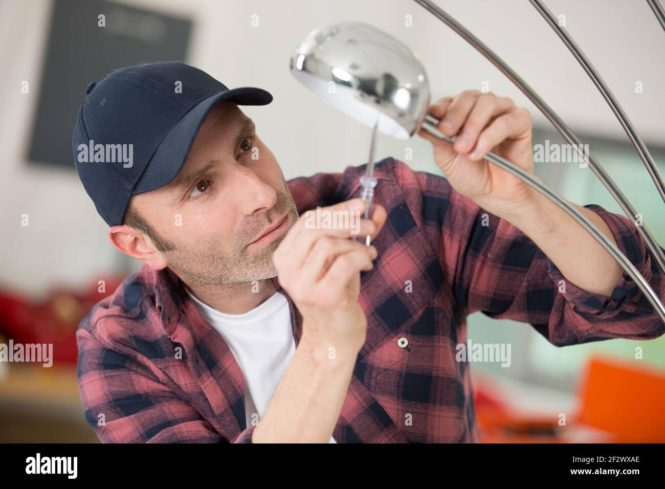Man hanging chandelier fixture hi-res stock photography and images - Alamy