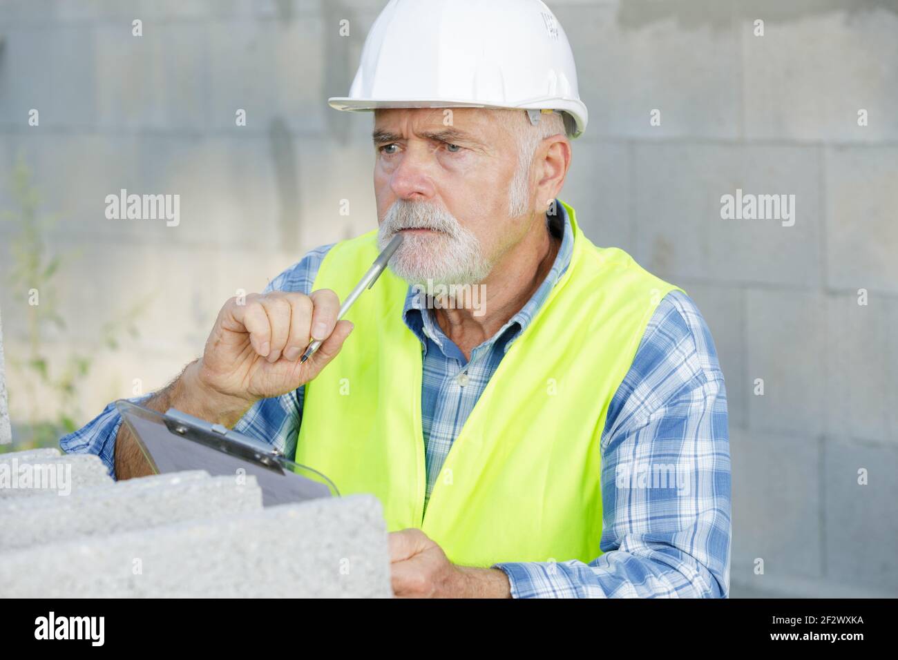 portrait of mature building inspector outdoors Stock Photo - Alamy