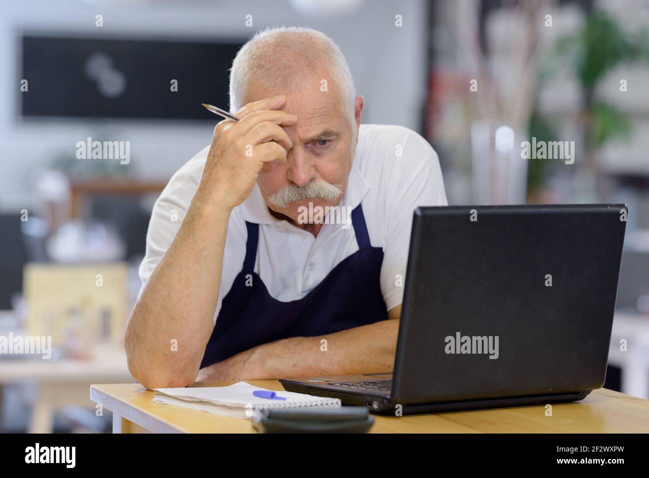 picture of problematic worker in his workshop Stock Photo - Alamy