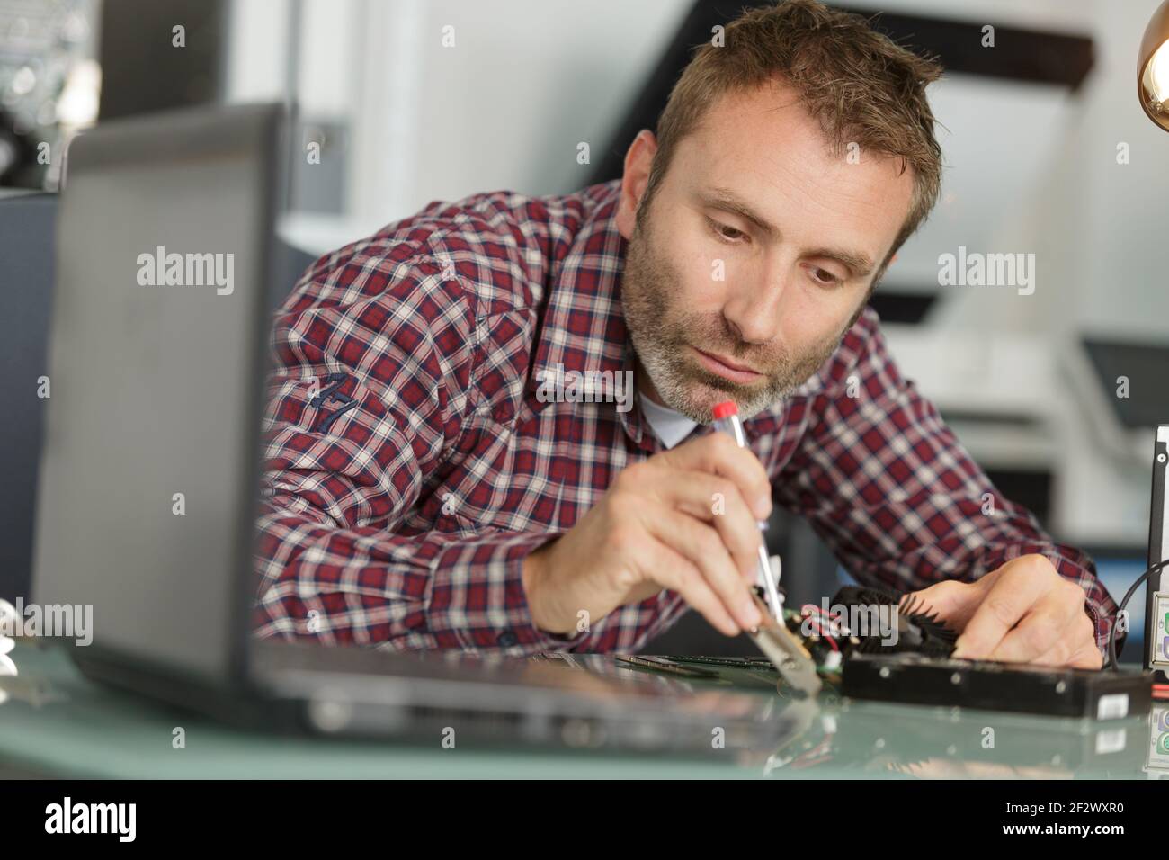 Master repairing computer board hi-res stock photography and images - Alamy