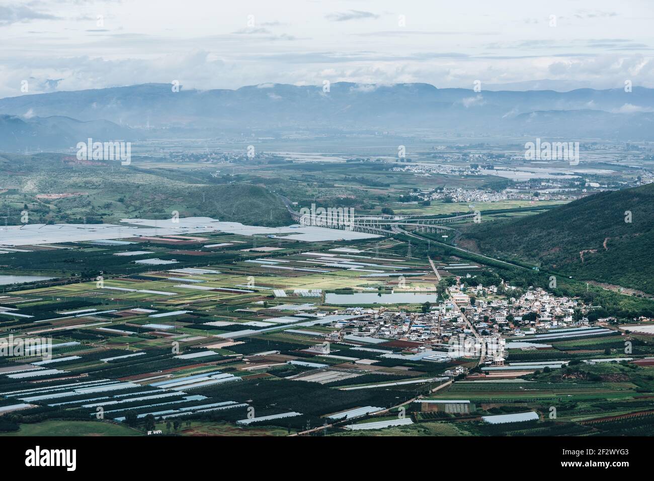 aerial view of agricultural plots of land under cultivation in an ...