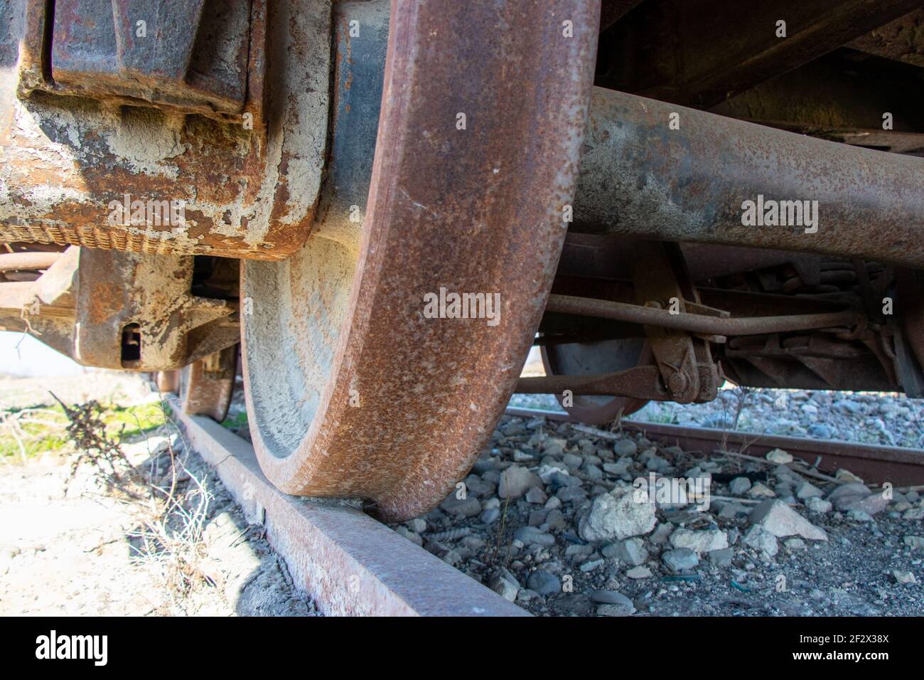 Closeup of the old rusty train wheels. Details of the wheel of train ...