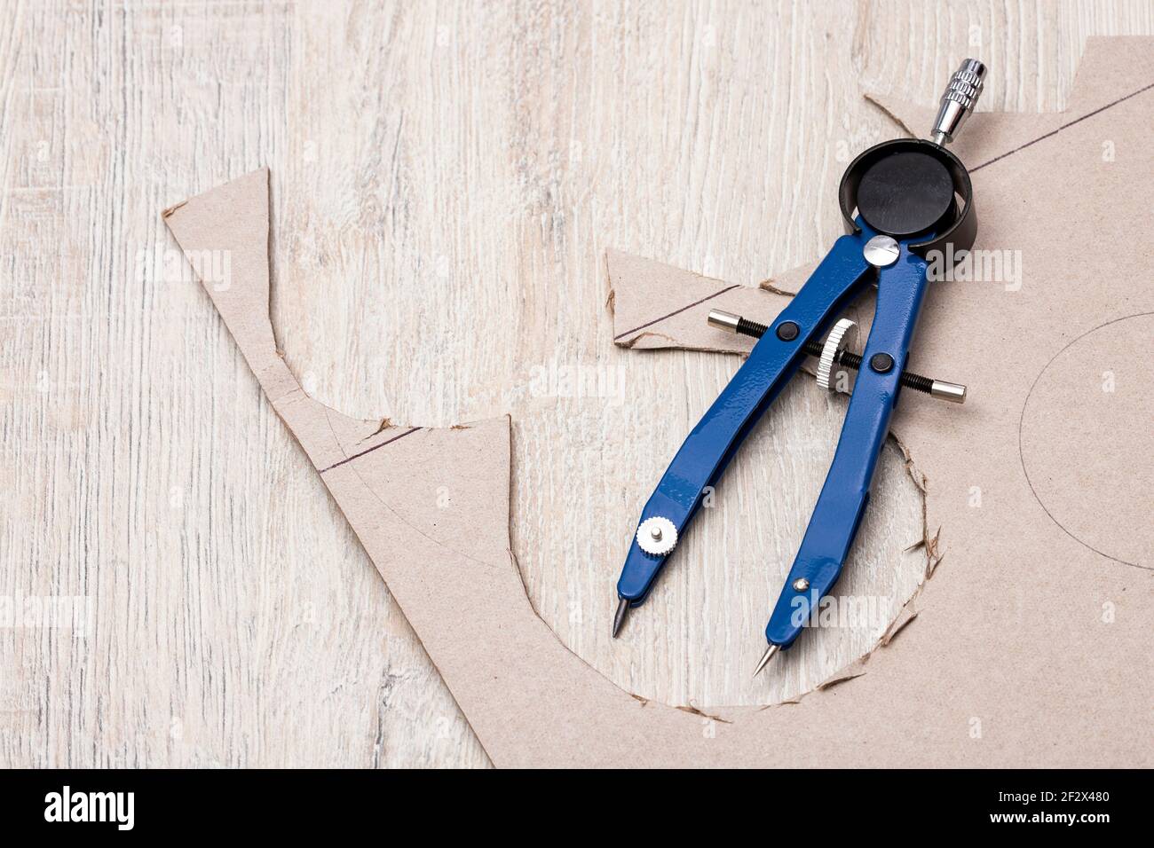 Metal compass for technical drawing - Text space Stock Photo - Alamy