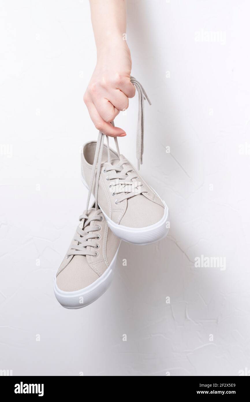 Woman holds pair shoes hi-res stock photography and images - Alamy