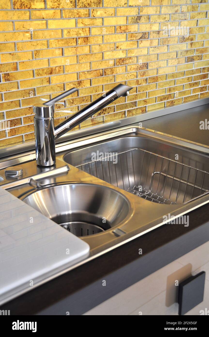 Interior of luxurious modern kitchen and stainless steel sink, tap and ...