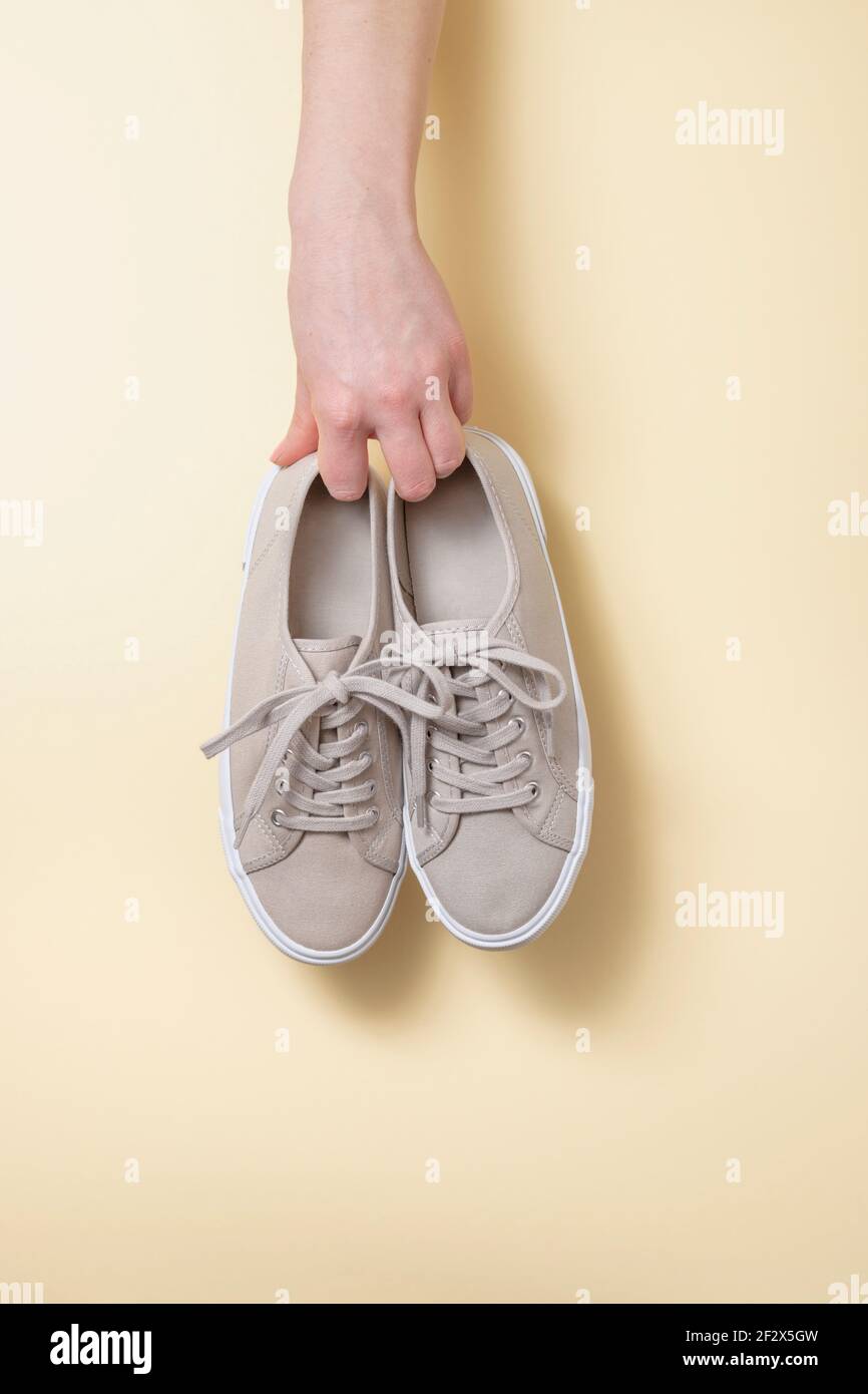 Woman holds pair shoes hi-res stock photography and images - Alamy