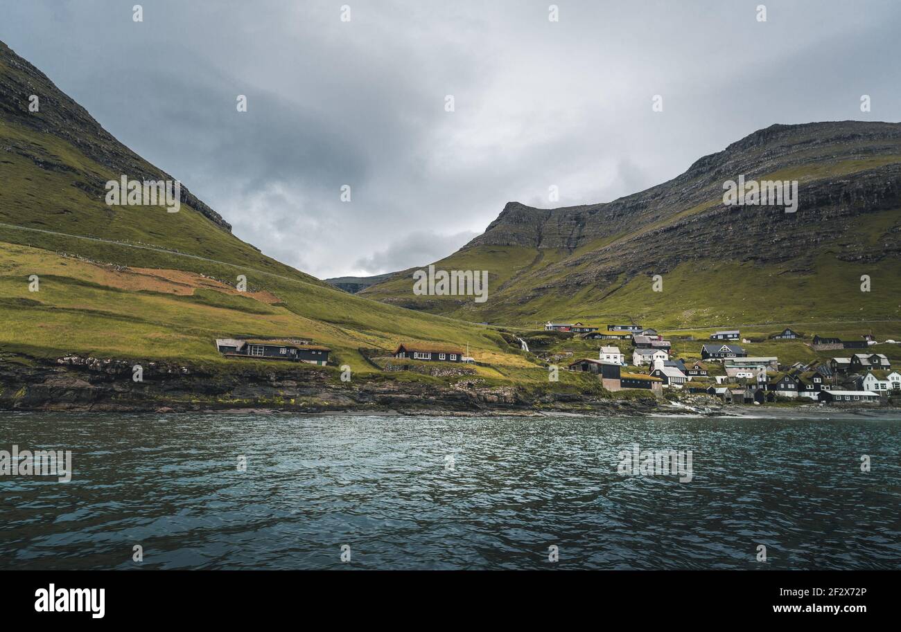 Bour village Grass-covered picturesque houses at the Faroese coastline ...
