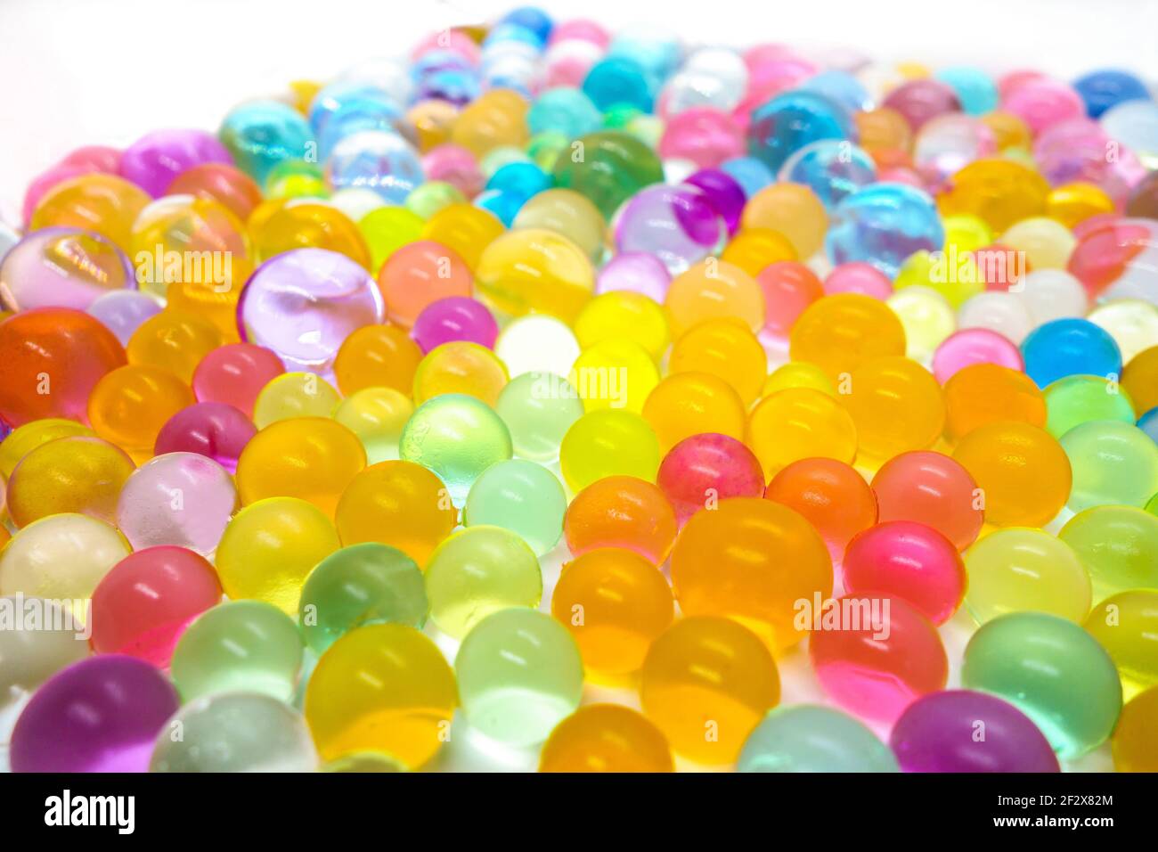 Many different colored small balls hi-res stock photography and images ...