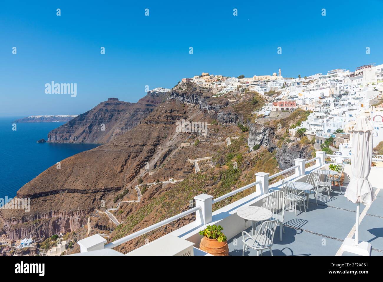 Terrace overlooking caldera of Santorini island in Greece Stock Photo ...
