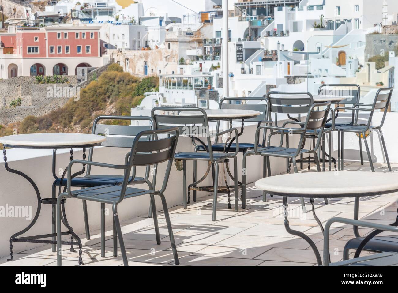 Terrace overlooking caldera of Santorini island in Greece Stock Photo ...