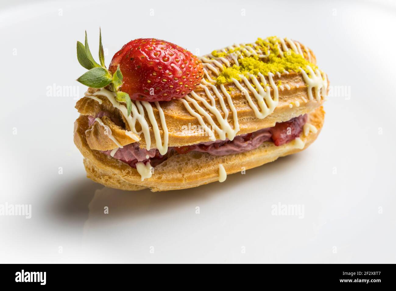 Traditional french eclairs with chocolate and Strawberry Stock Photo ...