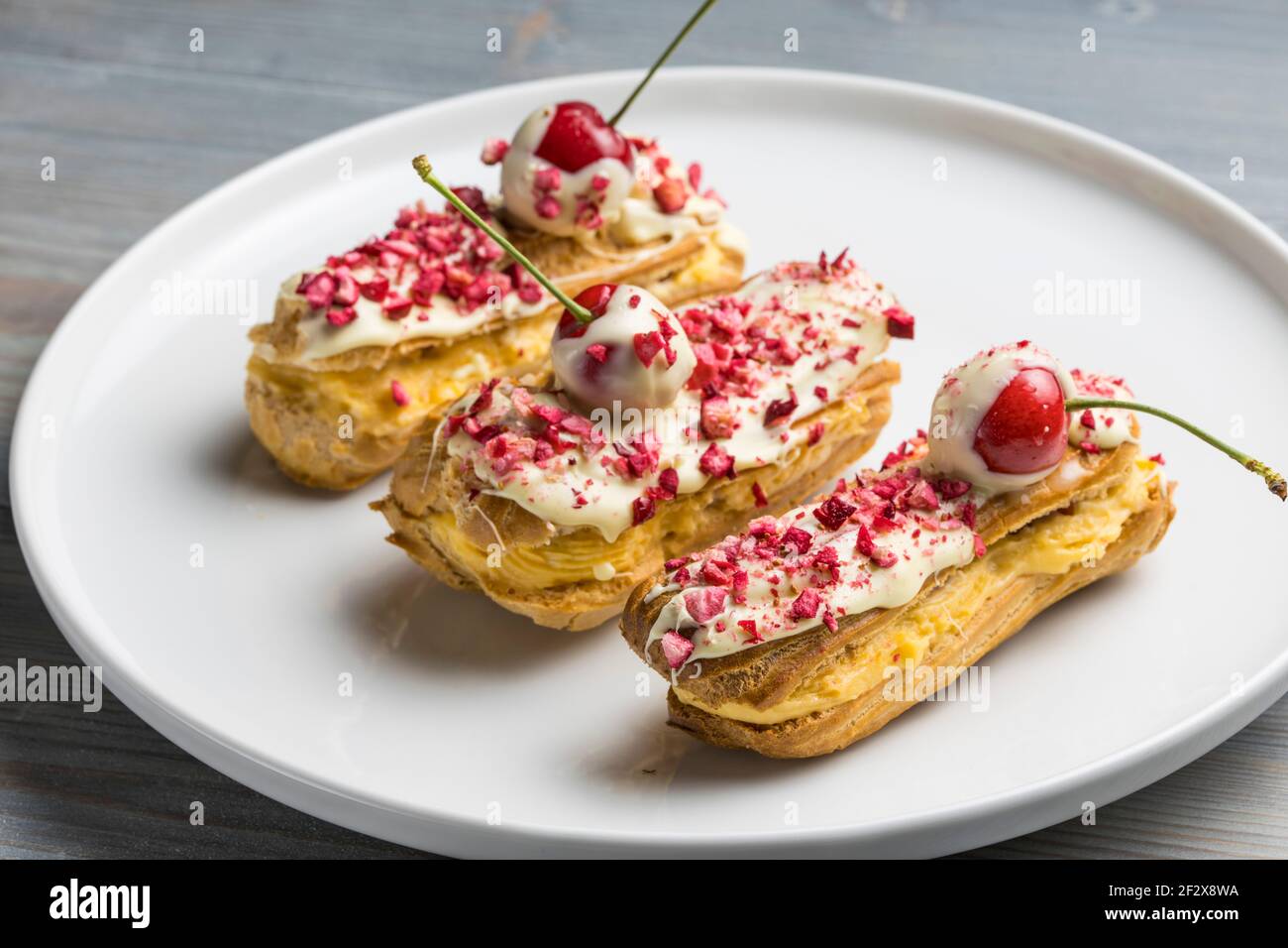 Traditional french eclairs with chocolate and Strawberry Stock Photo ...