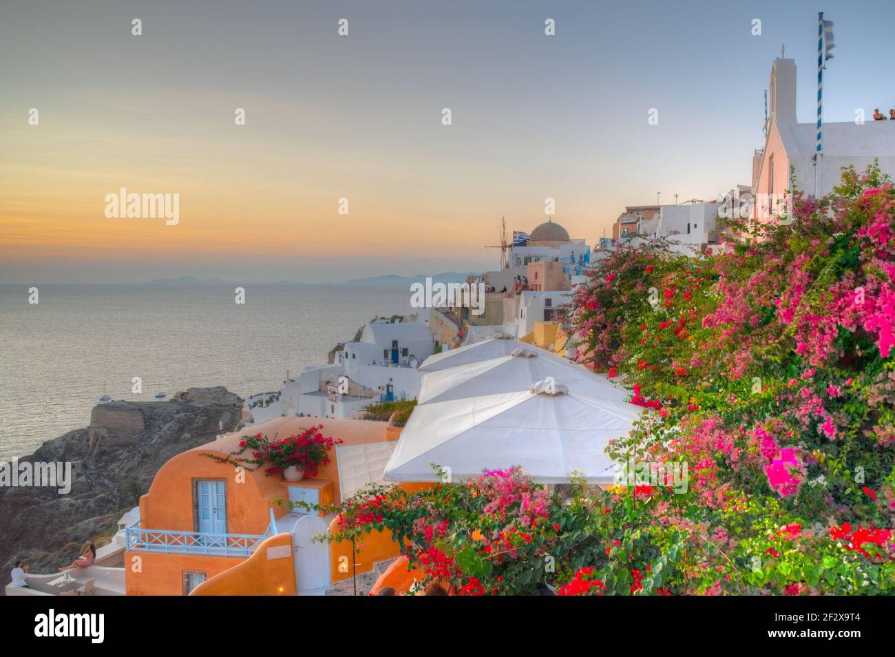 Sunset over Oia village In Santorini island, Greece Stock Photo - Alamy