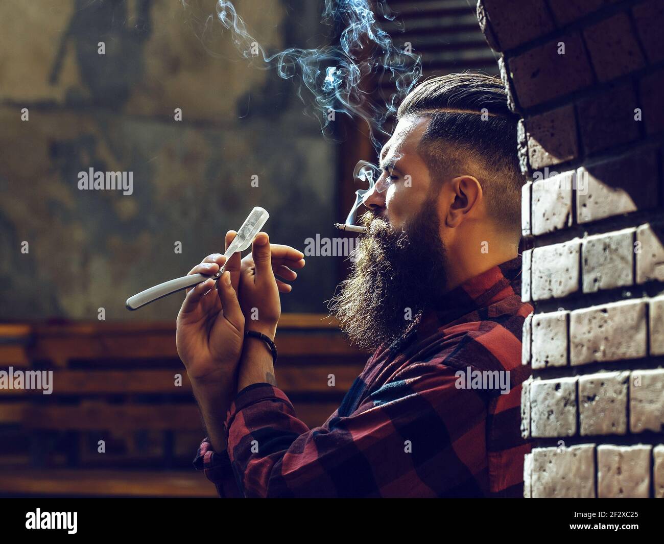 Hipster barber with handsome brutal face long beard and moustache ...