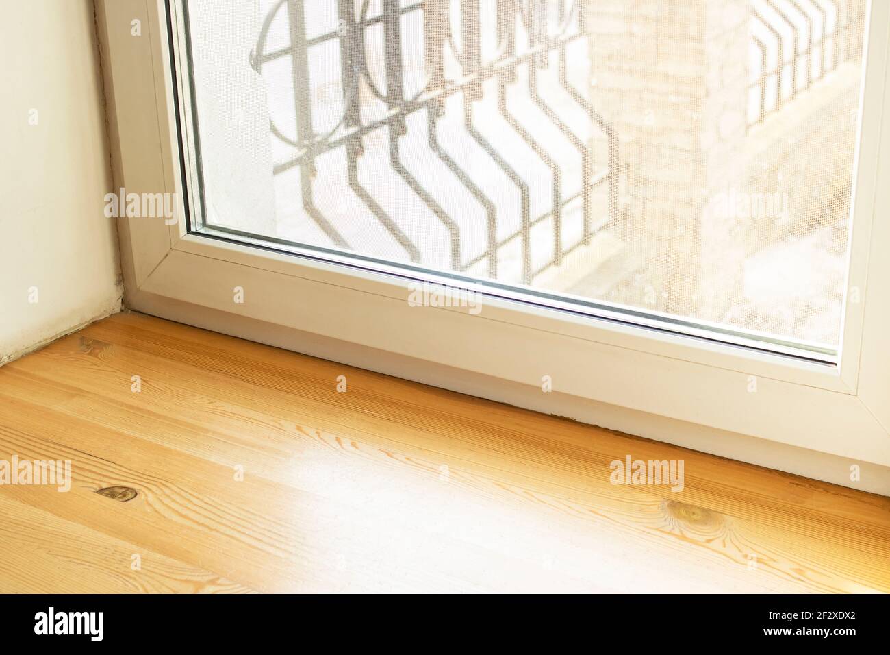 Yellow wooden window sill in sunlight close up Stock Photo - Alamy