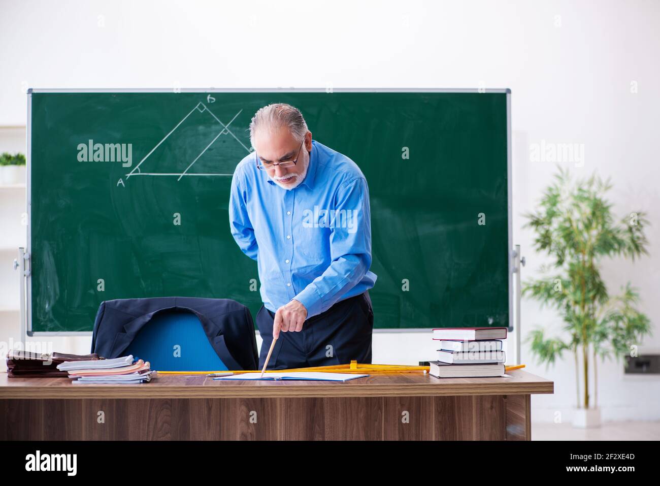 Elderly math teacher hi-res stock photography and images - Alamy