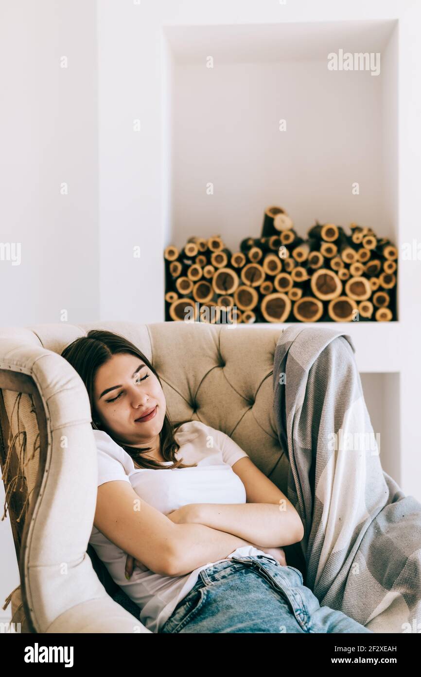 Girl sleeping in armchair hi-res stock photography and images - Alamy