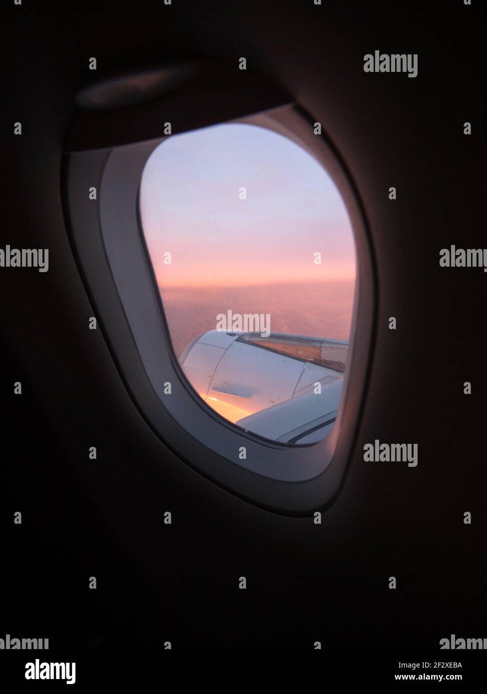 Andean sunset panorama colorful mountain layers haze fog with plane ...