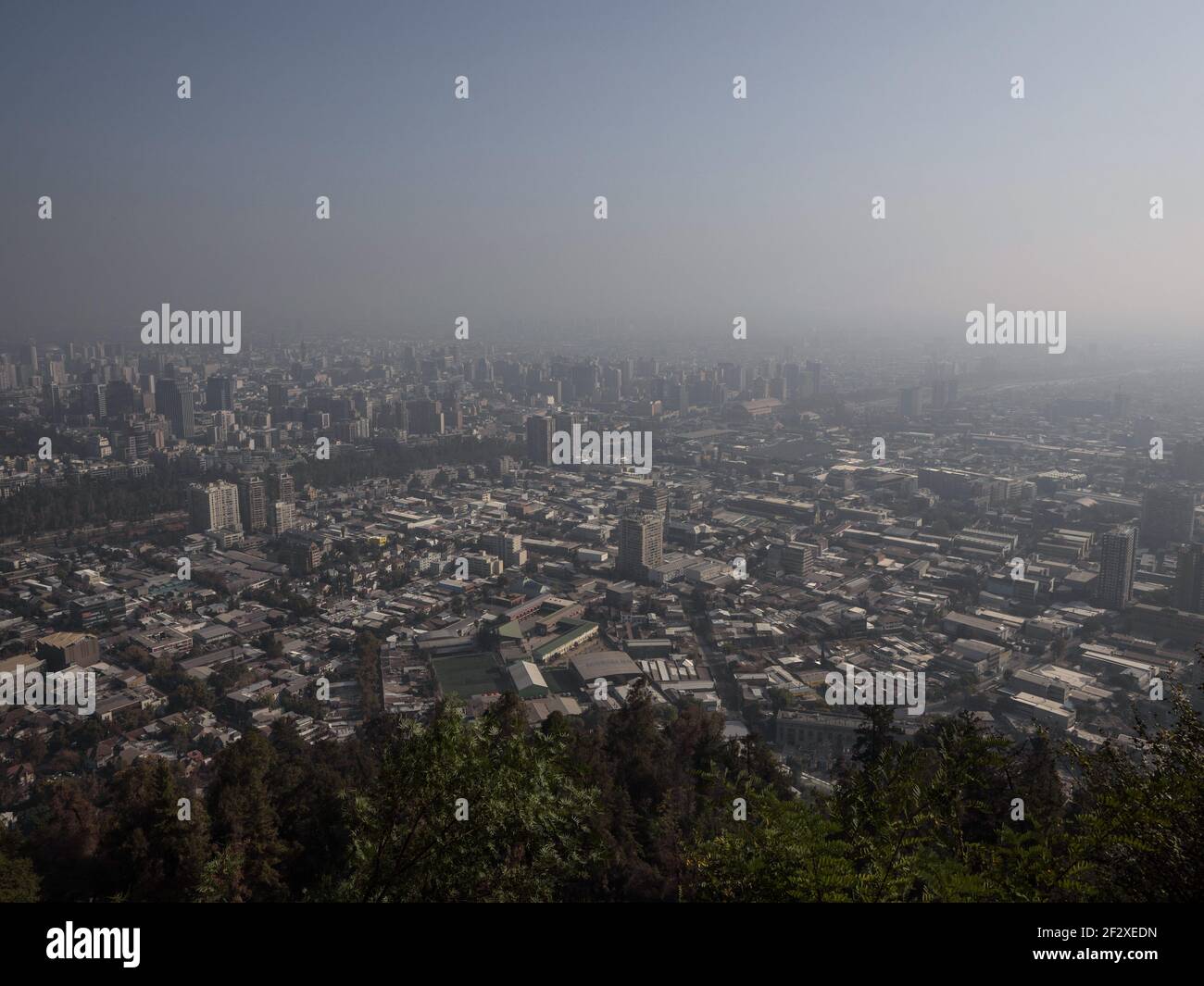 Aerial panorama of Santiago de Chile cityscape in dense fog haze smog ...