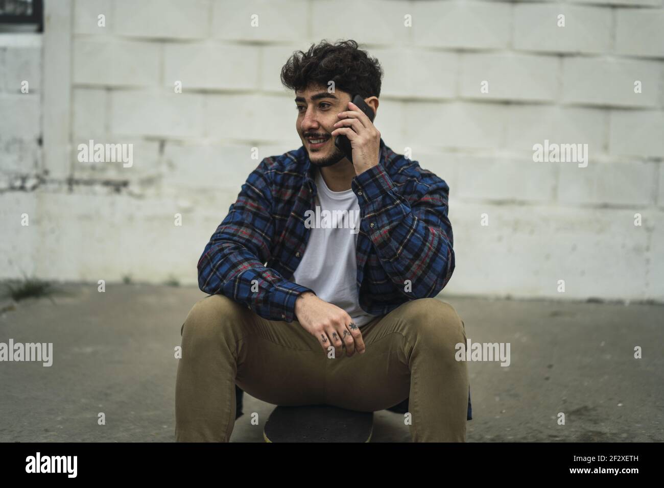 Young spanish male talking hi-res stock photography and images - Alamy