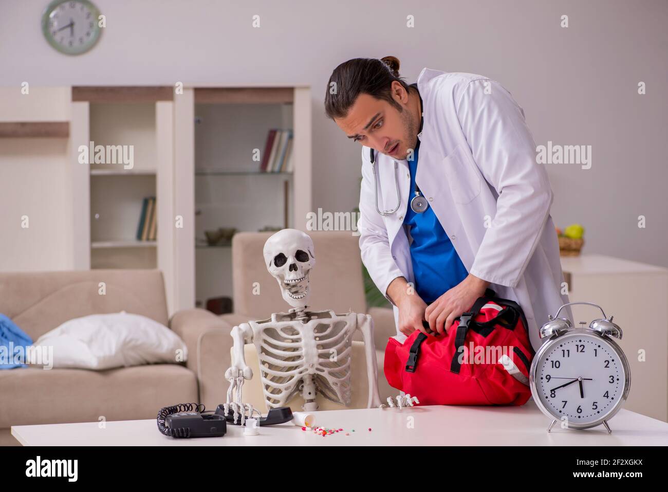 Male paramedic visiting skeleton patient Stock Photo - Alamy