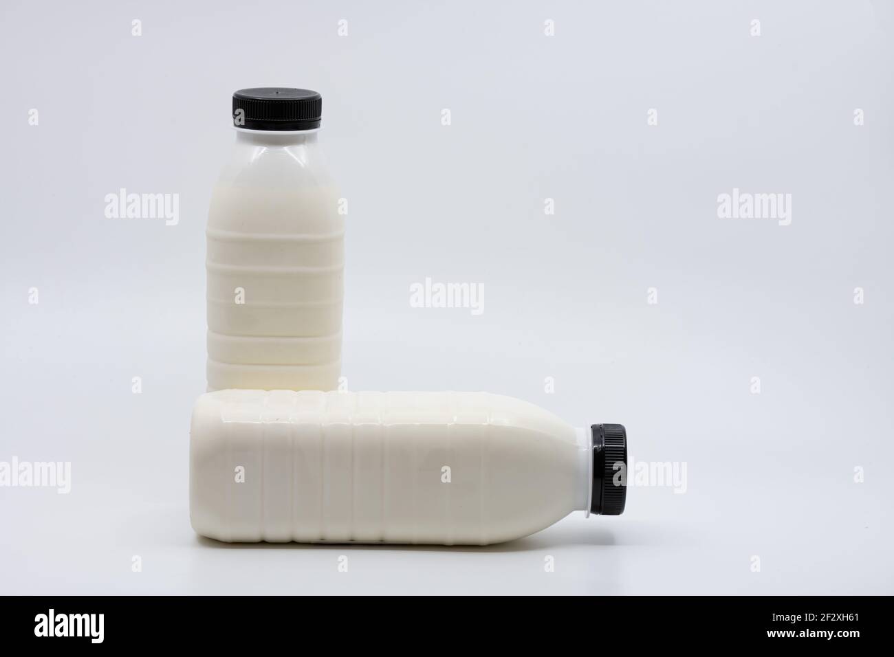 Two Bottle off Milk Isolated on White Background Stock Photo - Alamy
