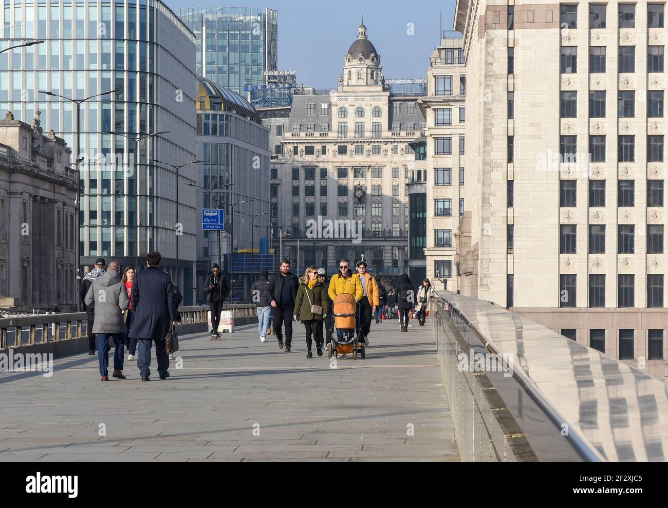People walking across the London Bridge on sunny day Stock Photo - Alamy