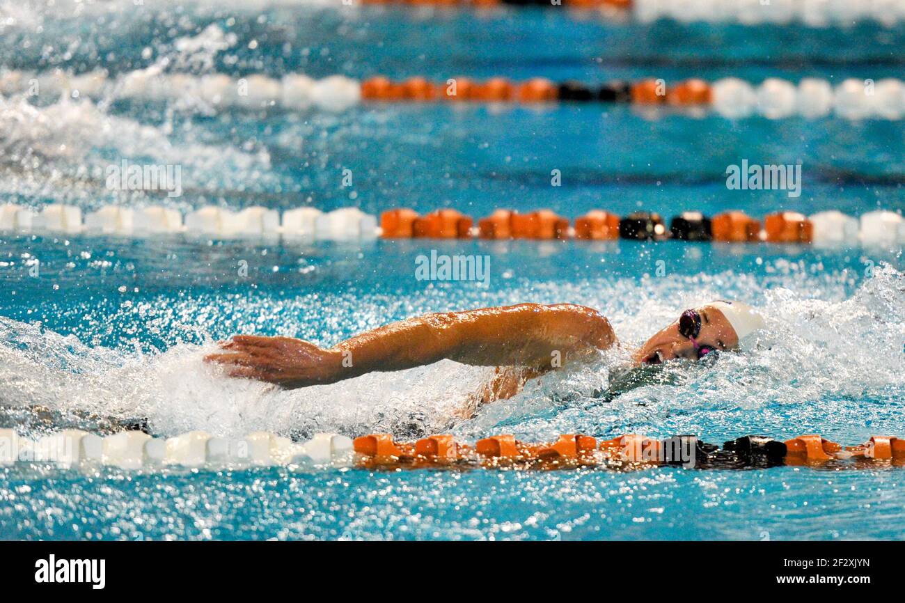 A female freestyle swimmer breathes during in a race in an Olympic long ...