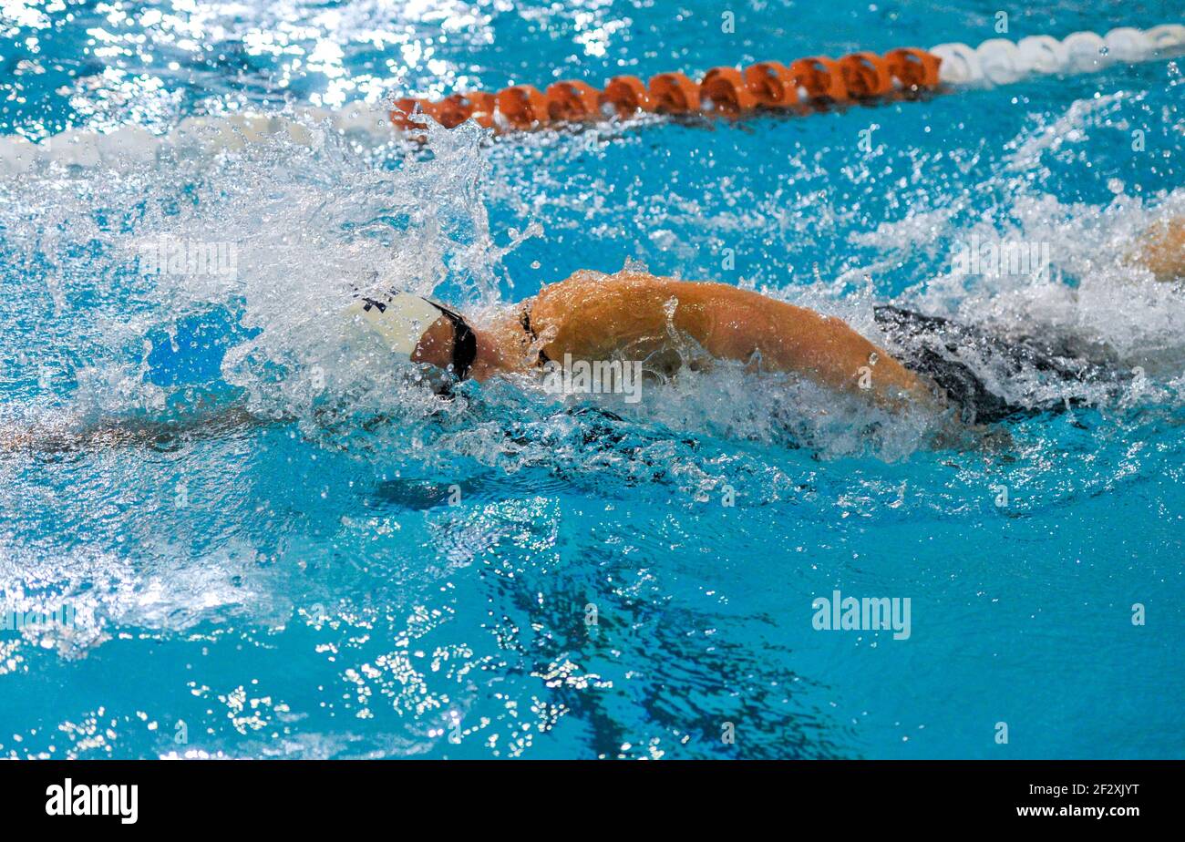 A female freestyle swimmer breathes during in a race in an Olympic long ...
