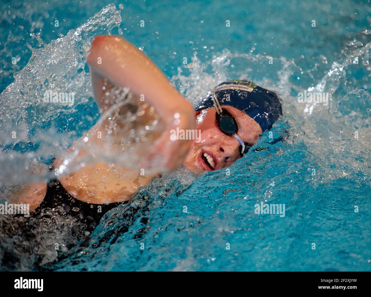 A female freestyle swimmer breathes during in a race in an Olympic long ...