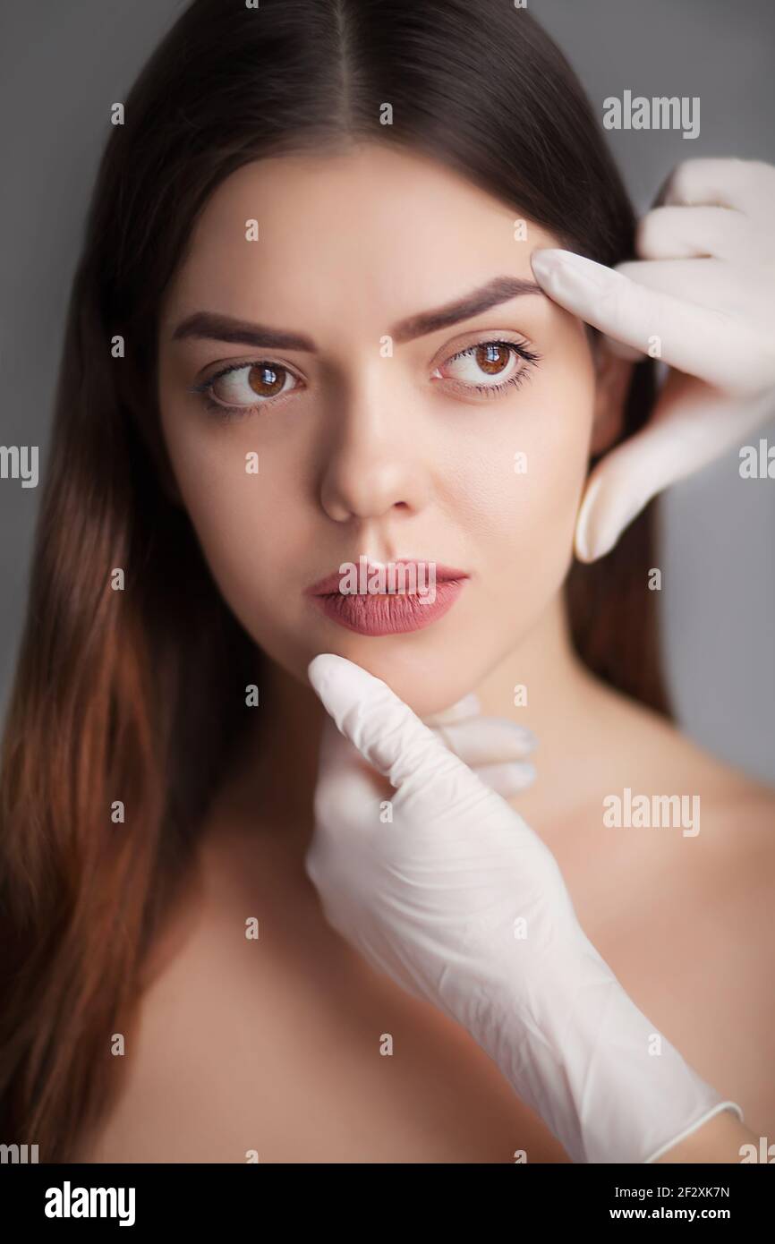 beautiful model applying cosmetic cream treatment on her face Stock Photo - Alamy