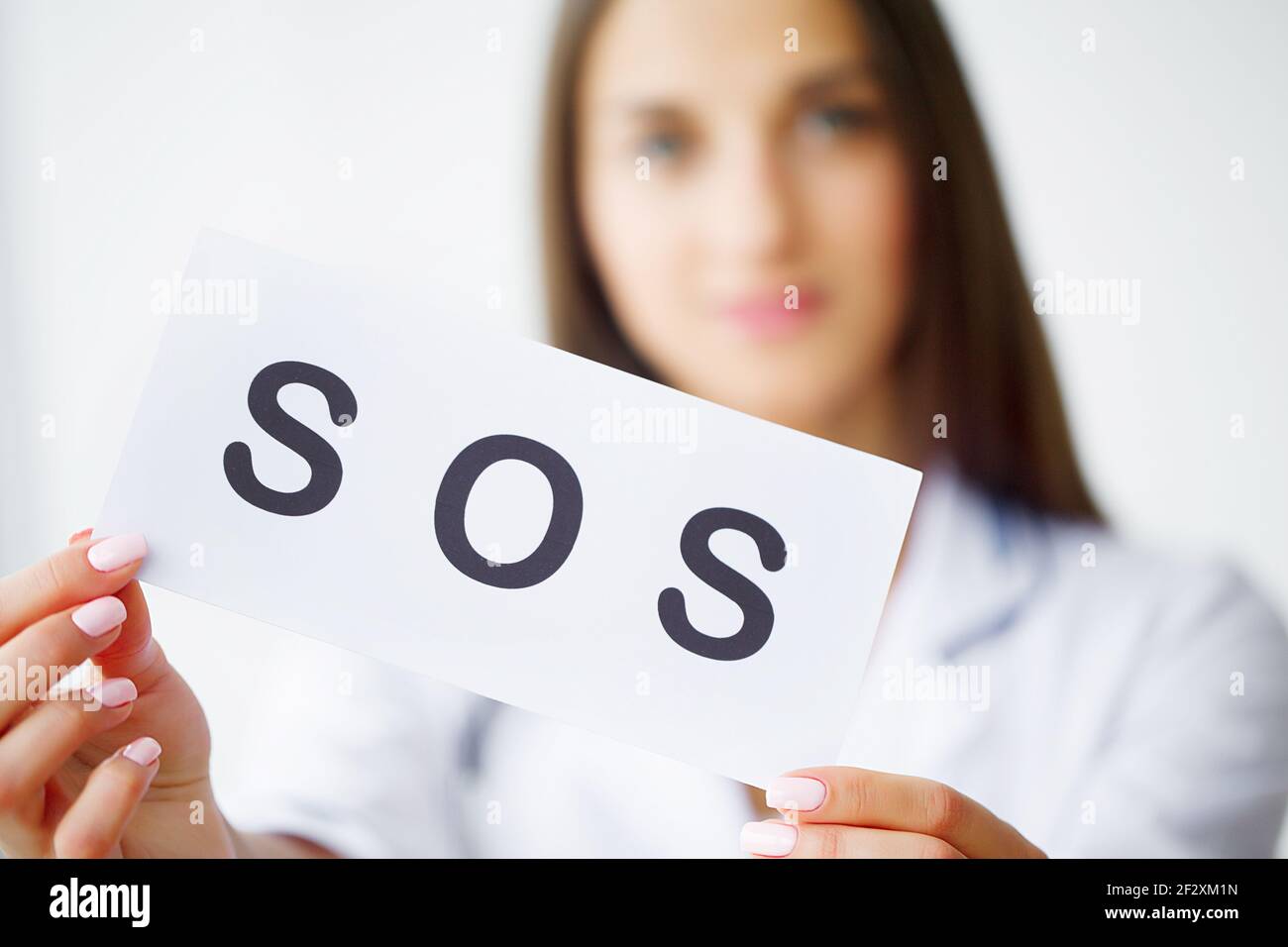 Health Care. Doctor Holding a Card With Symbol SOS, Medical Concept ...