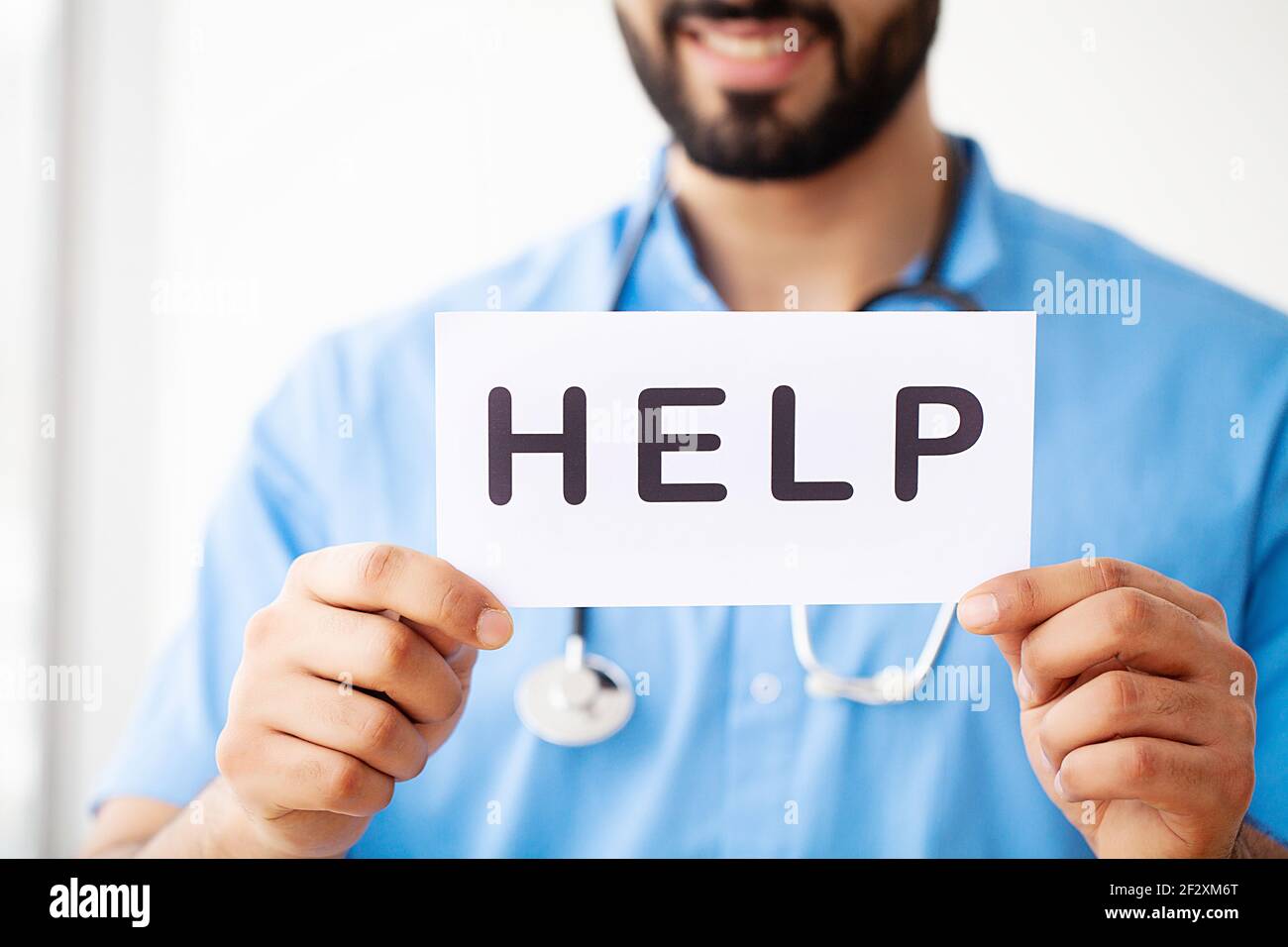 Health Care. Doctor Holding a Card With Symbol HELP, Medical Concept ...