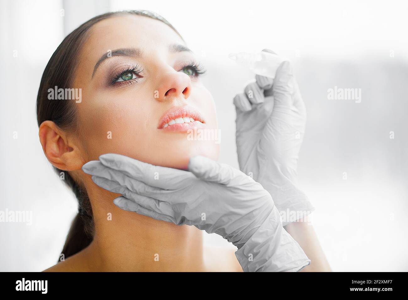 Health and Beauty. Eye Care. Beautiful Young Woman Holding Drops For ...