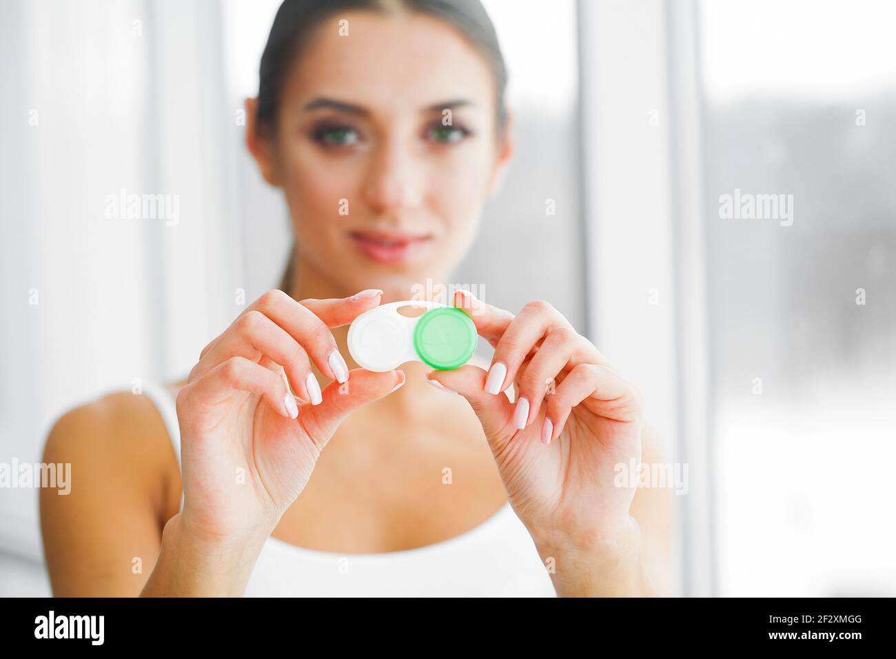Vision And Medicine Concept. Young Girl Holds Eye Drops In Hands ...